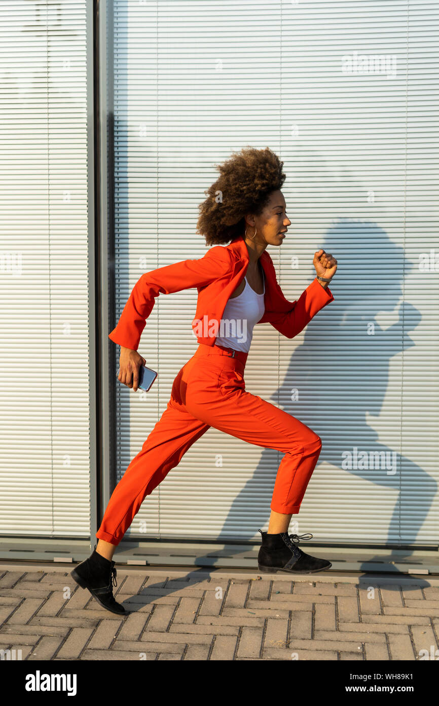 Woman wearing red running hi-res stock photography and images - Alamy