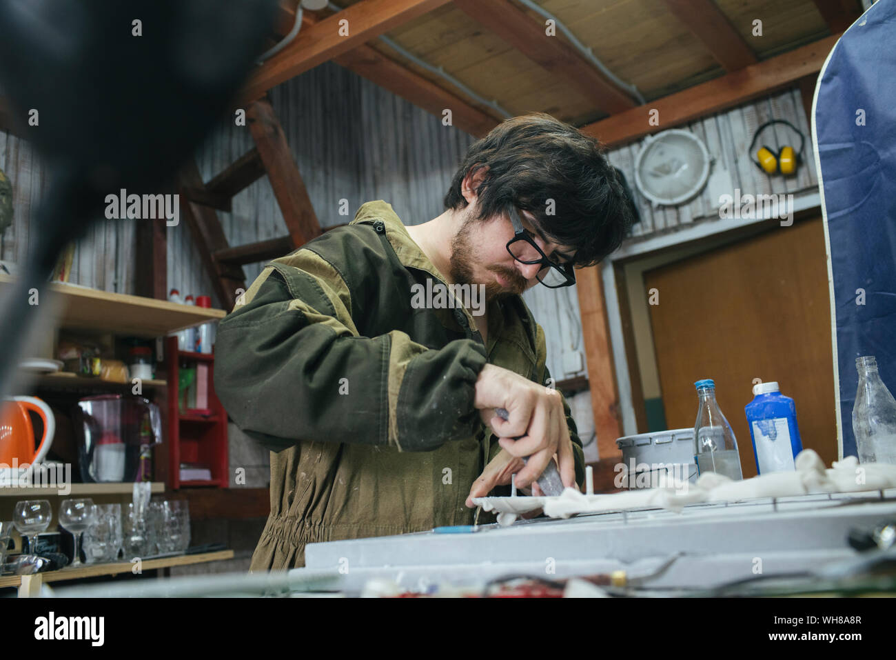 Sculptor working on an object Stock Photo - Alamy