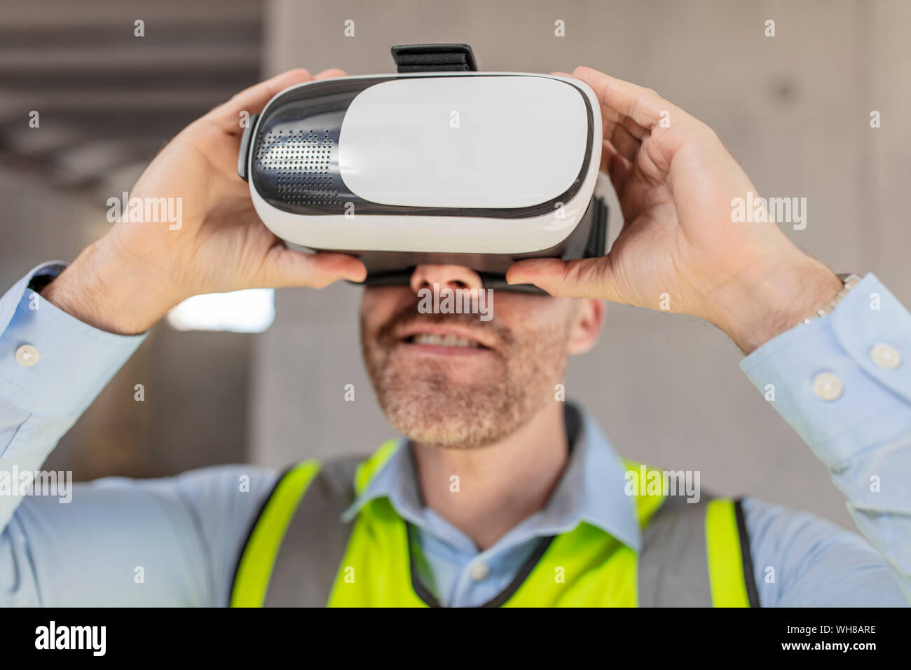 Architect with VR glasses at construction site Stock Photo - Alamy