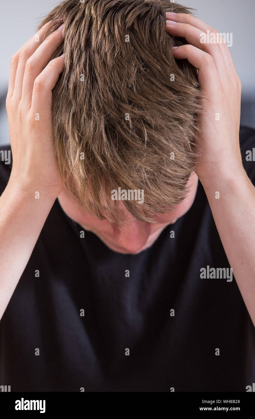 A stressed teenage boy studying for his exams Stock Photo - Alamy