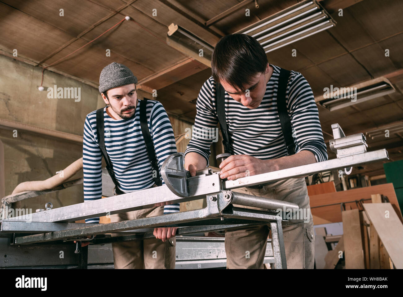 Carpenters at work on a saw Stock Photo - Alamy