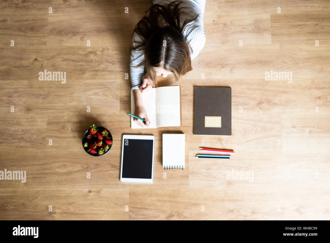 Woman working tablet taking notes hi-res stock photography and images ...