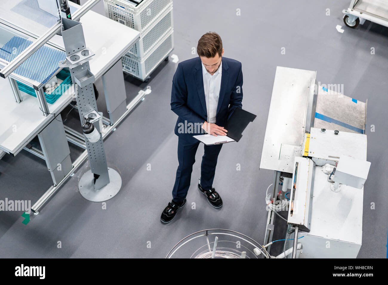 Person in suit with clipboard hi-res stock photography and images - Alamy