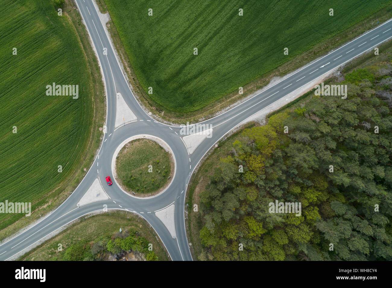 Aerial view of roundabout intersection with traffic. Franconia, Bavaria ...