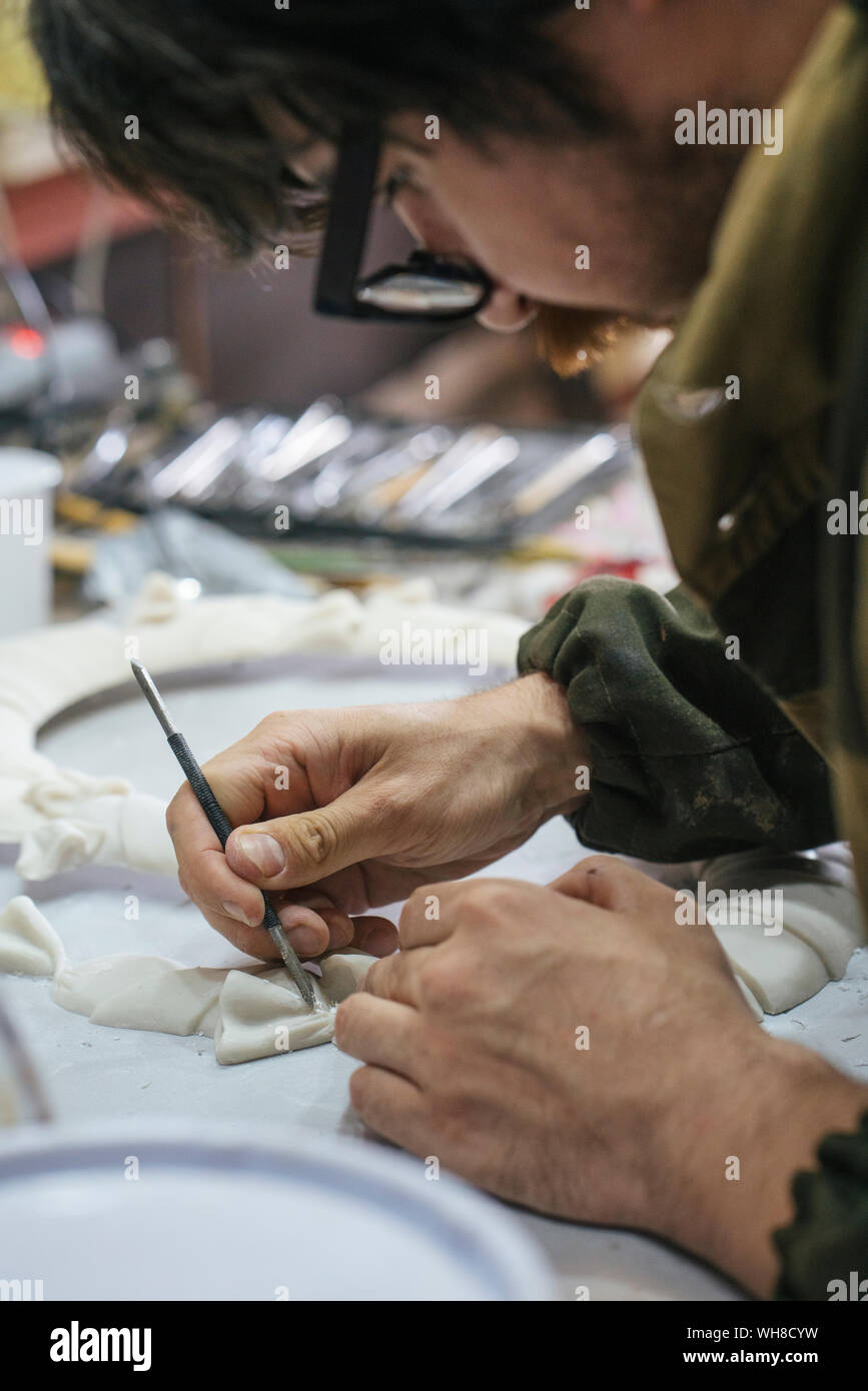 Sculptor working on an object Stock Photo - Alamy