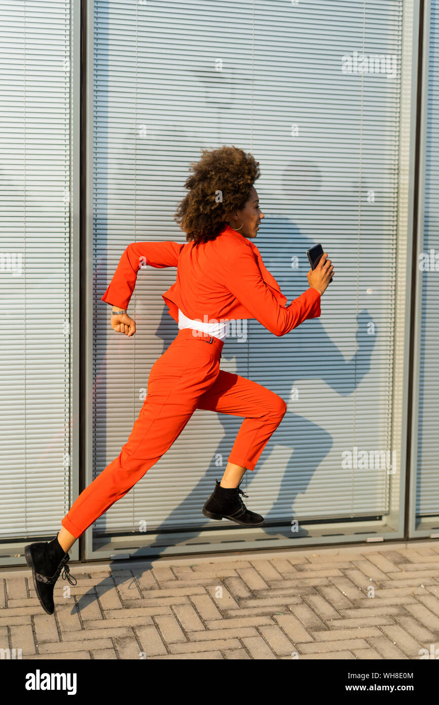Woman wearing red running hi-res stock photography and images - Alamy