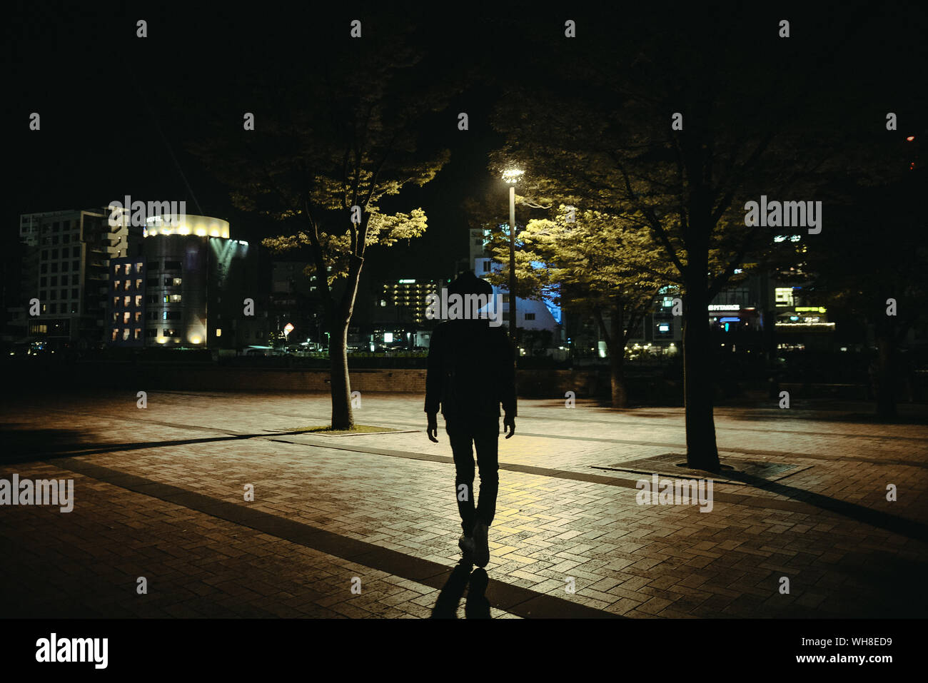 Man walking at night hi-res stock photography and images - Alamy