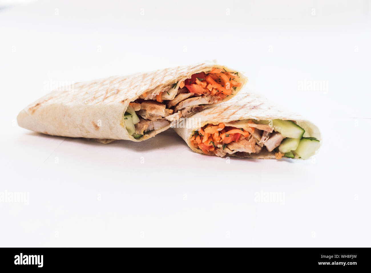 Isolated shawarma with a shadow. Oriental food made from chicken meat ...