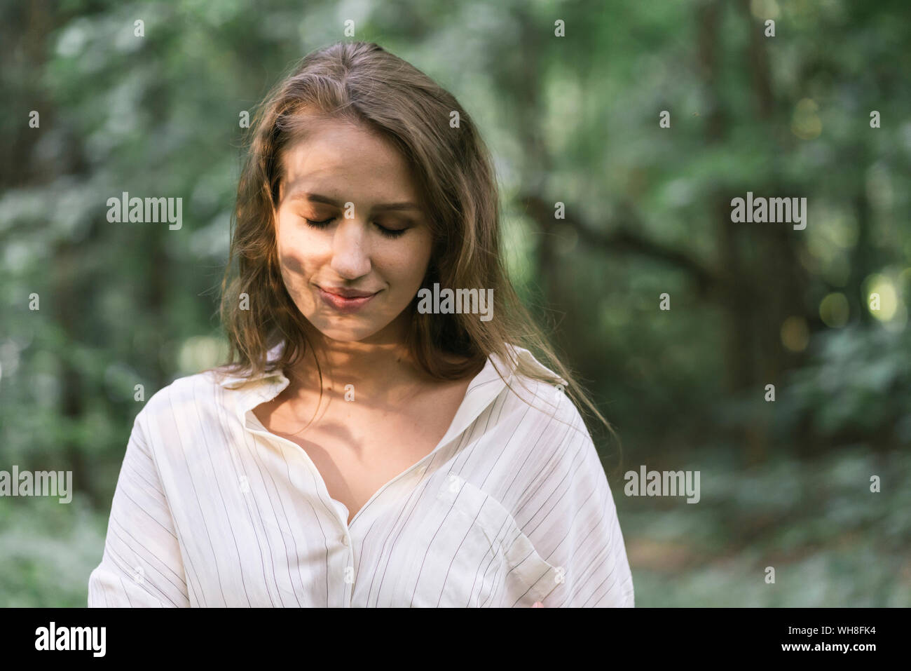 Woman enjoying forest hi-res stock photography and images - Alamy