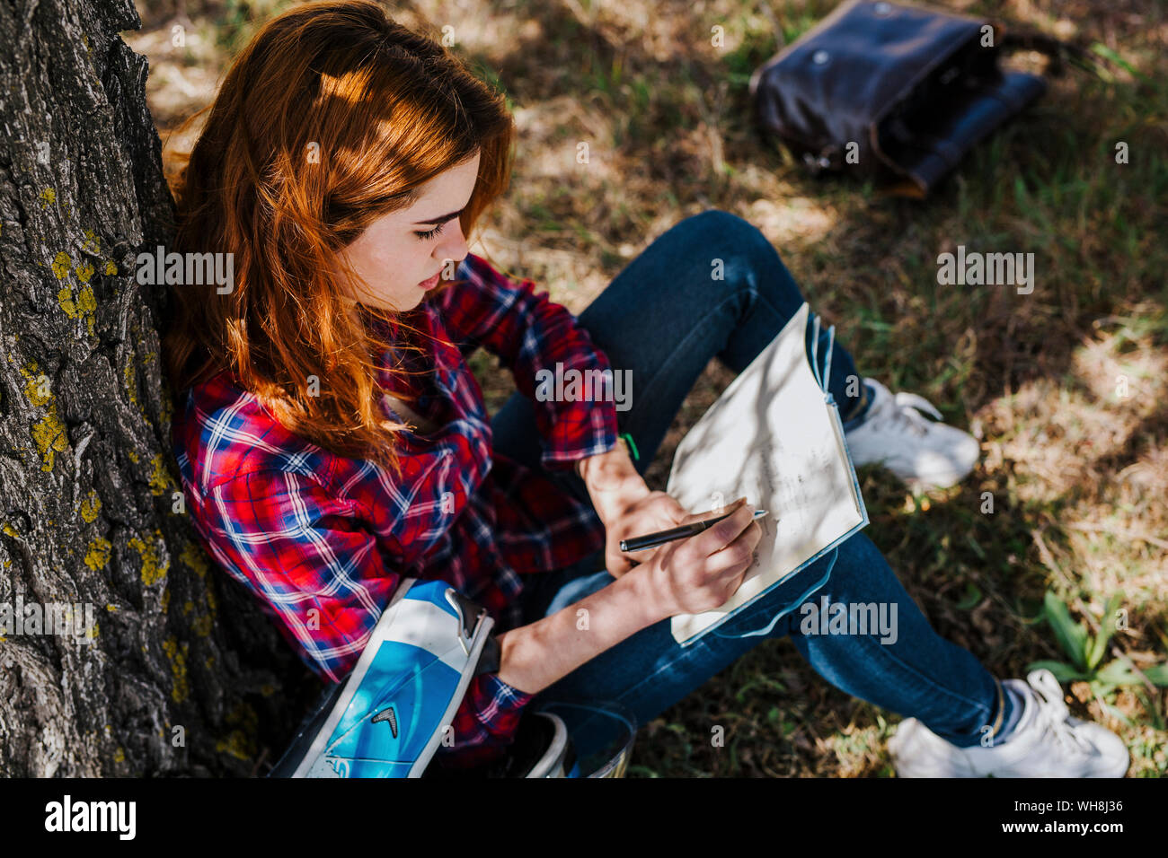 Resting against tree hi-res stock photography and images - Alamy