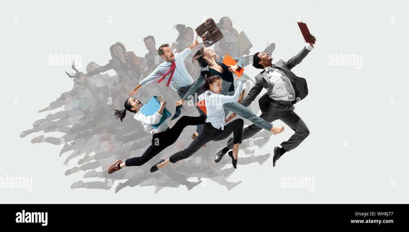 Happy office workers jumping and dancing in casual clothes or suit with ...