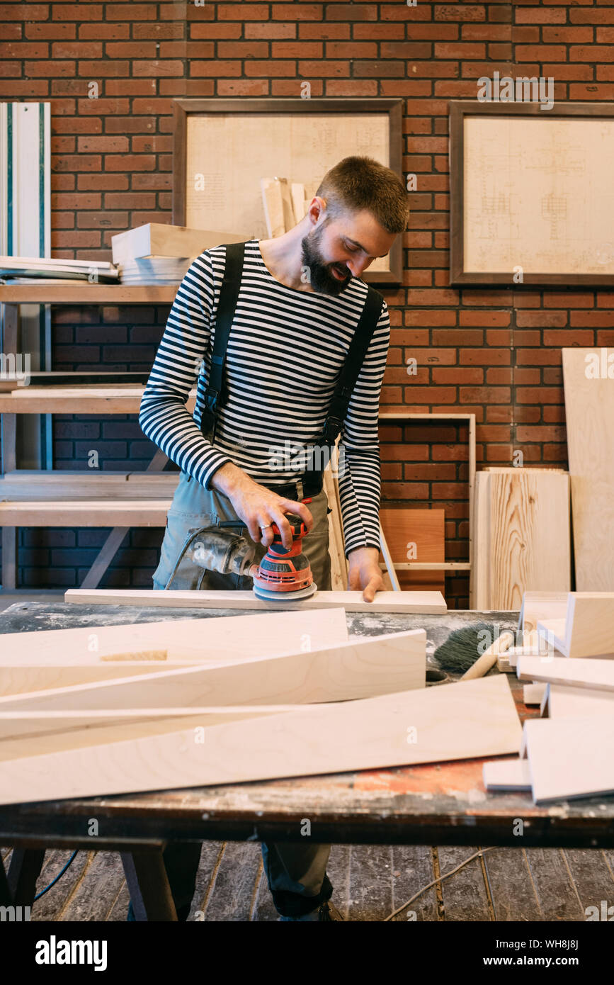 Work grinding hi-res stock photography and images - Alamy