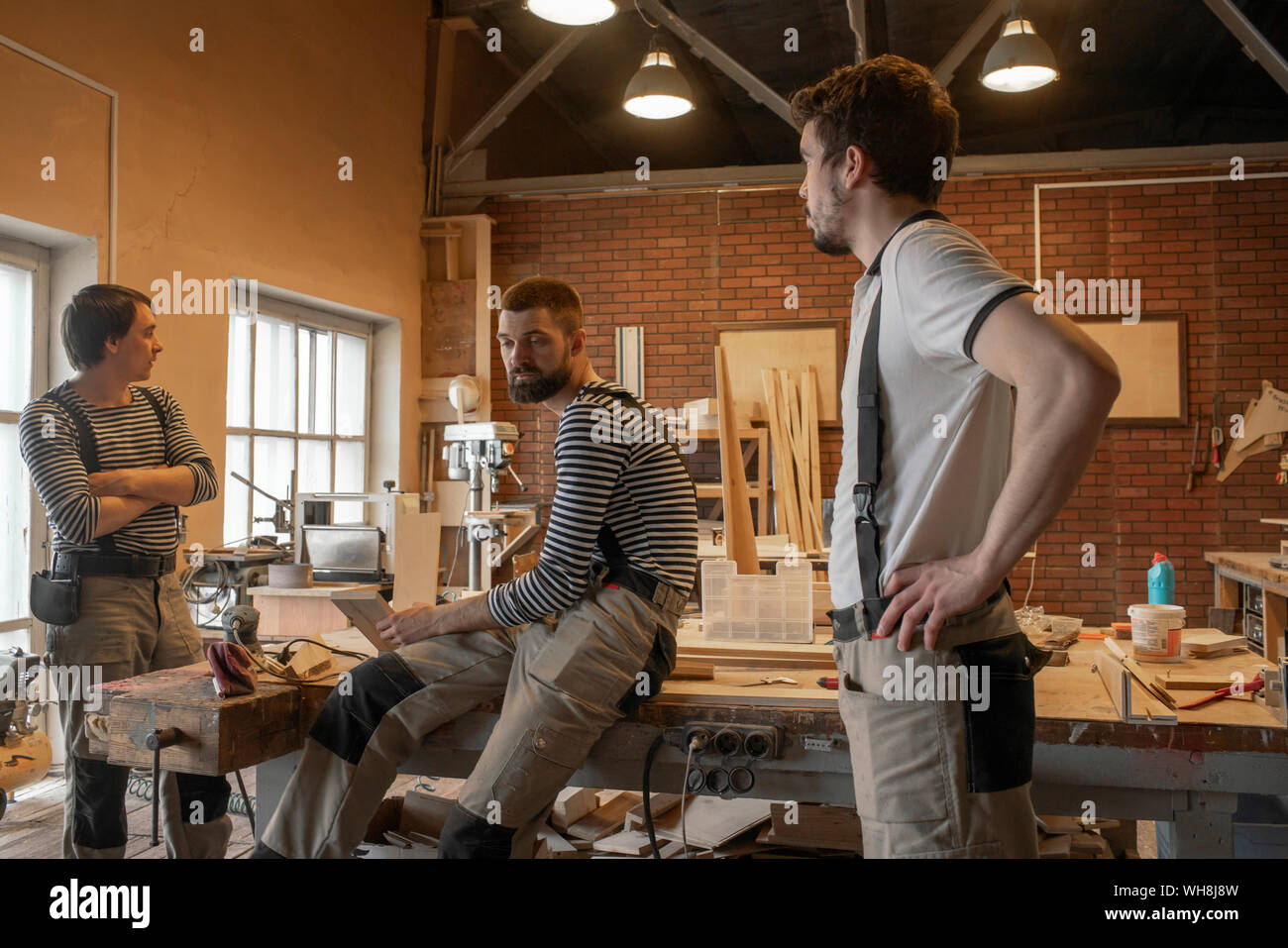 Team of carpenters in the workshop Stock Photo - Alamy