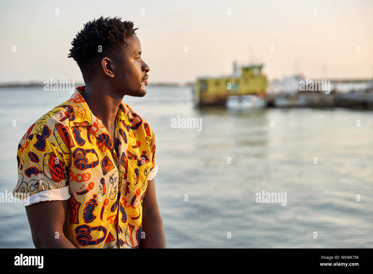 Man standing by the sea hi-res stock photography and images - Alamy