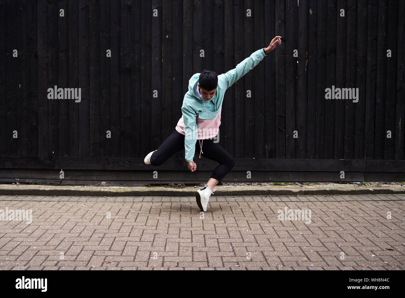Young man dancing outdoors hi-res stock photography and images - Alamy