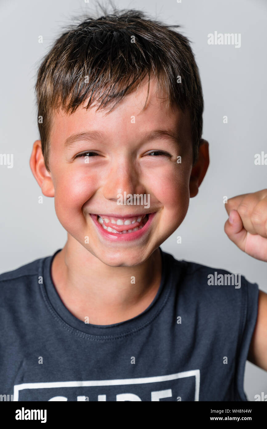 Portrait of strong boy, laughing, white background Stock Photo - Alamy