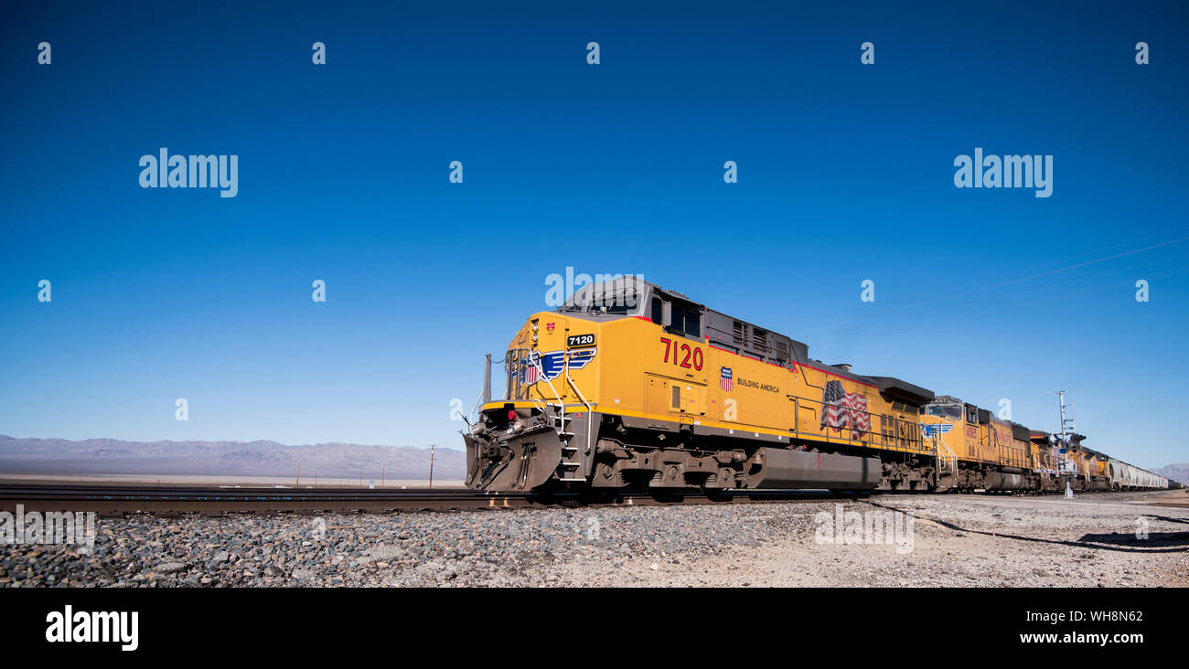 A Union Pacific freight train passes the railroad crossing in Nipton ...