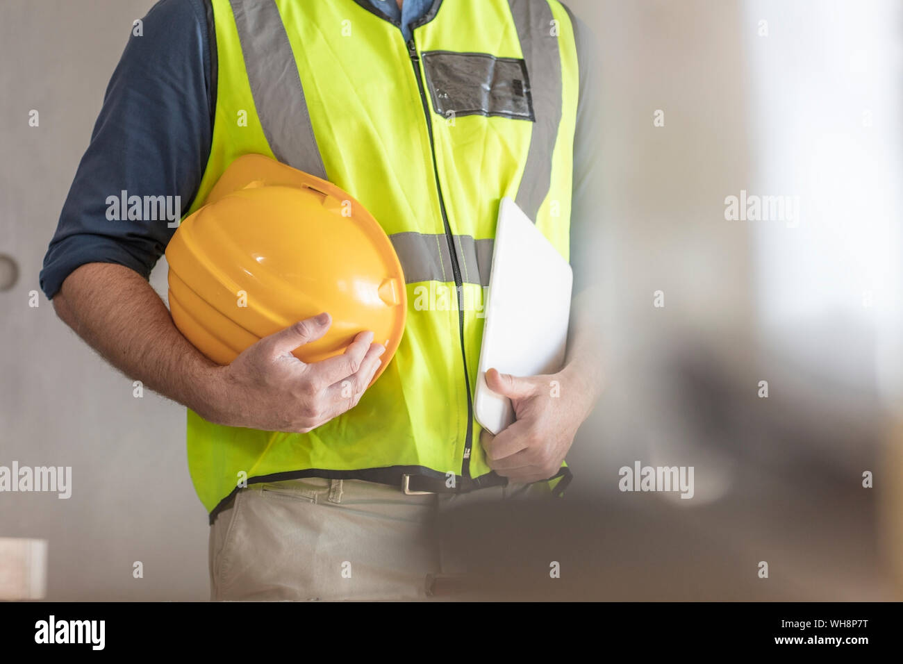 Architect with hardhat and safety vest Stock Photo - Alamy