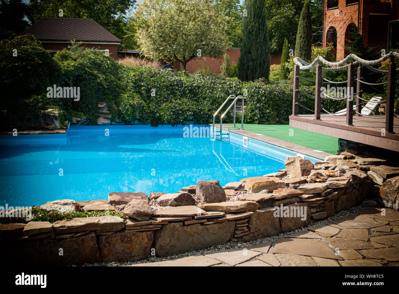 private pool with perimeter stones and steps Stock Photo - Alamy
