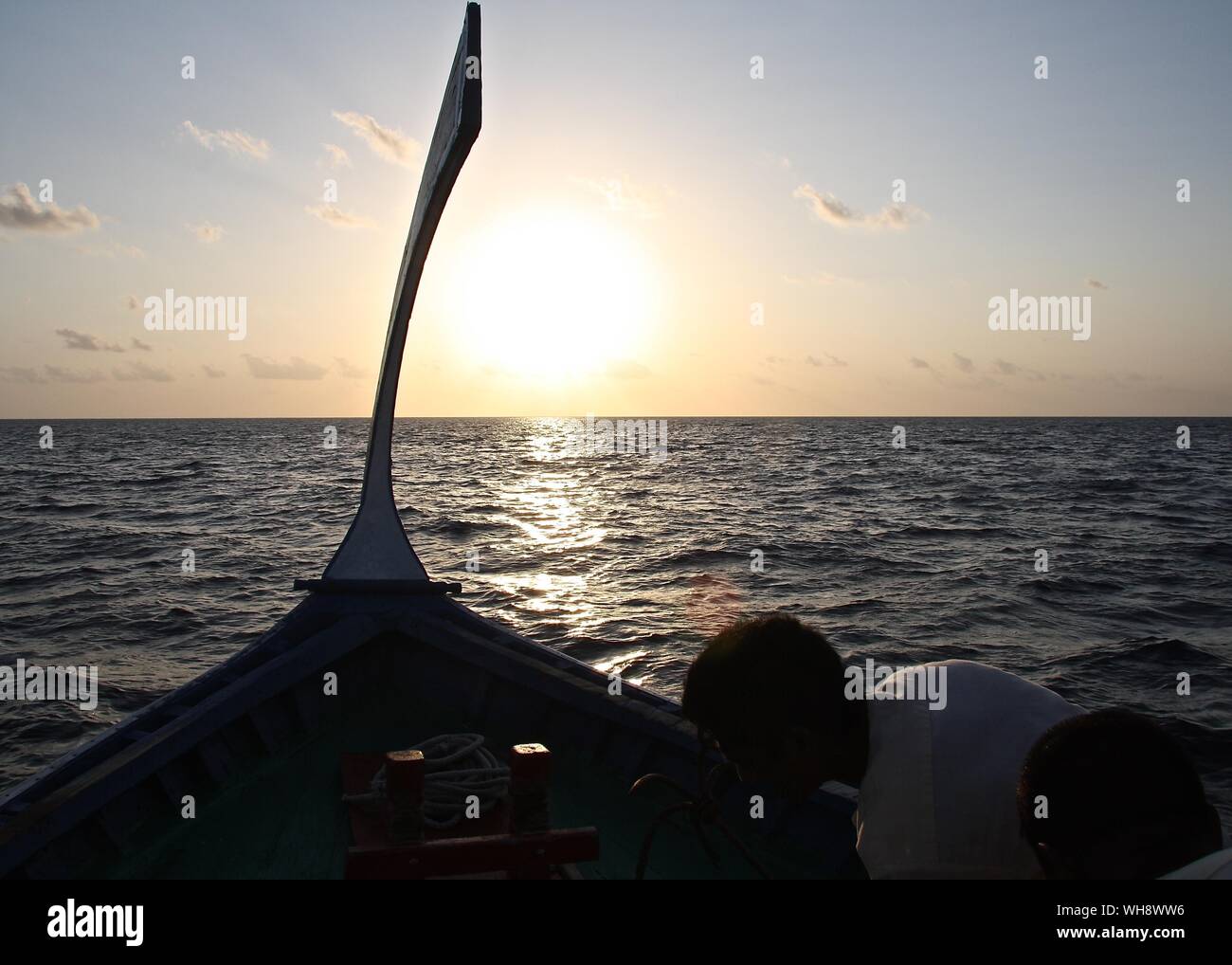 Tip Of A Boat Against Sunset Over Sea Stock Photo - Alamy