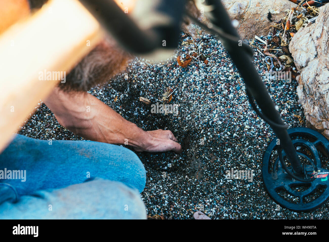Man holding metal detector hi-res stock photography and images - Alamy
