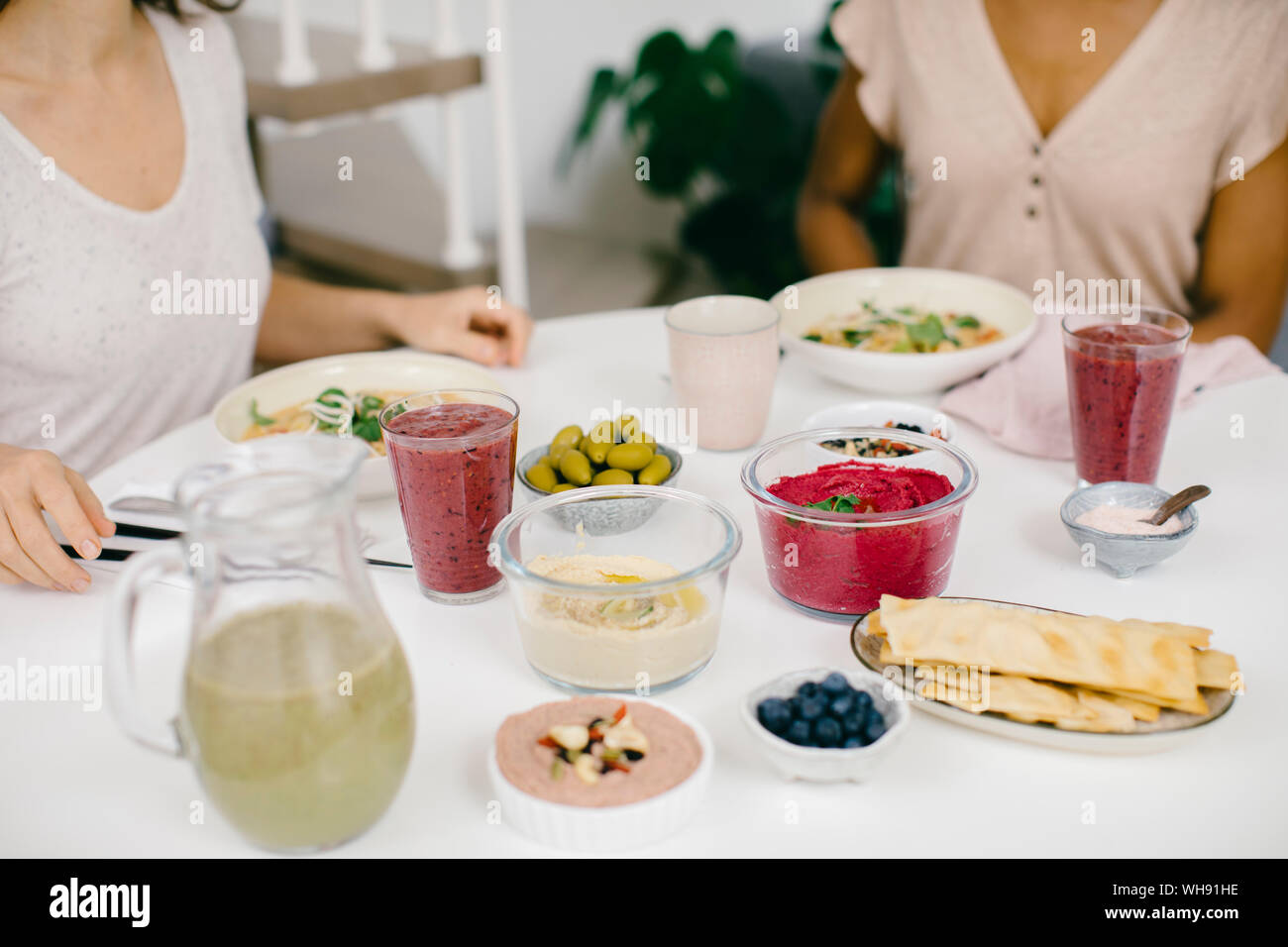 Woman eating healthy meal sitting table hi-res stock photography and ...