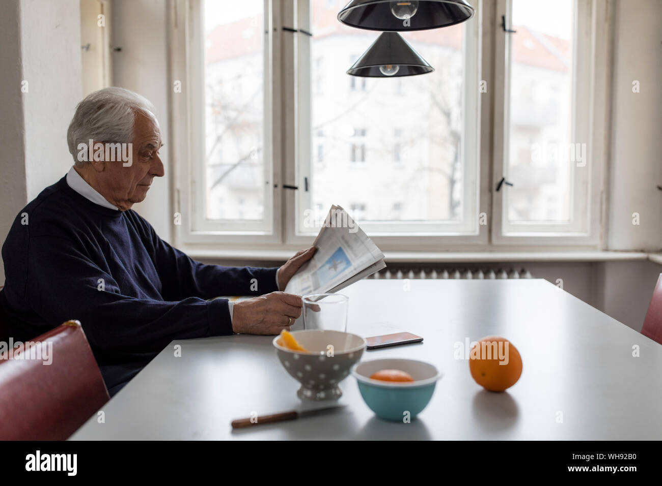 Senior caucasian man eating breakfast hi-res stock photography and ...
