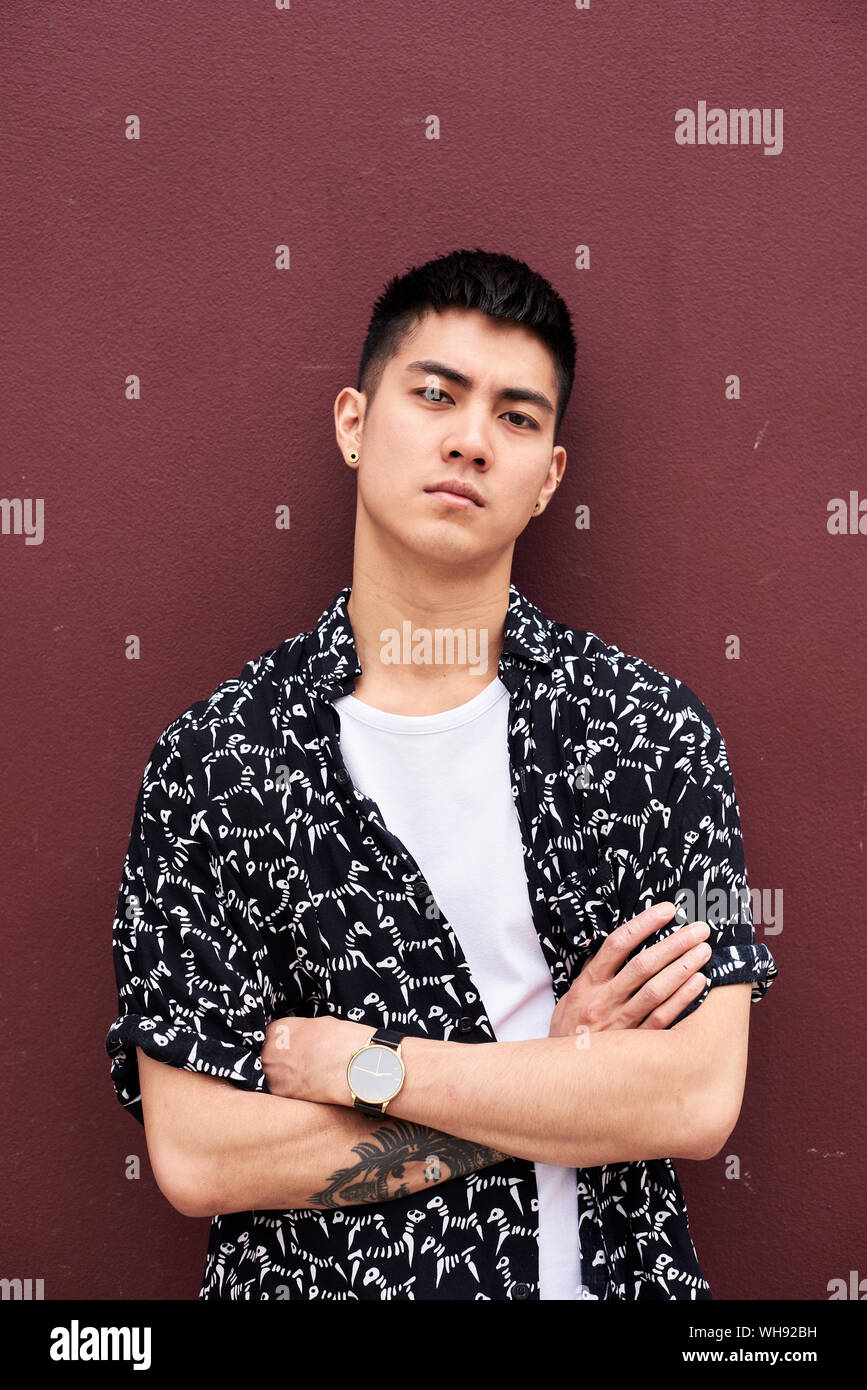 Portrait of serious looking young man Stock Photo - Alamy