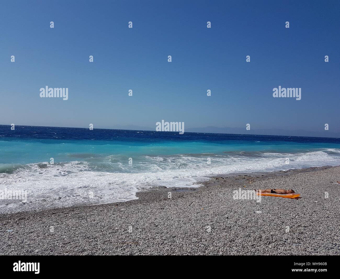 Person sunbathing beach sun hi-res stock photography and images - Alamy