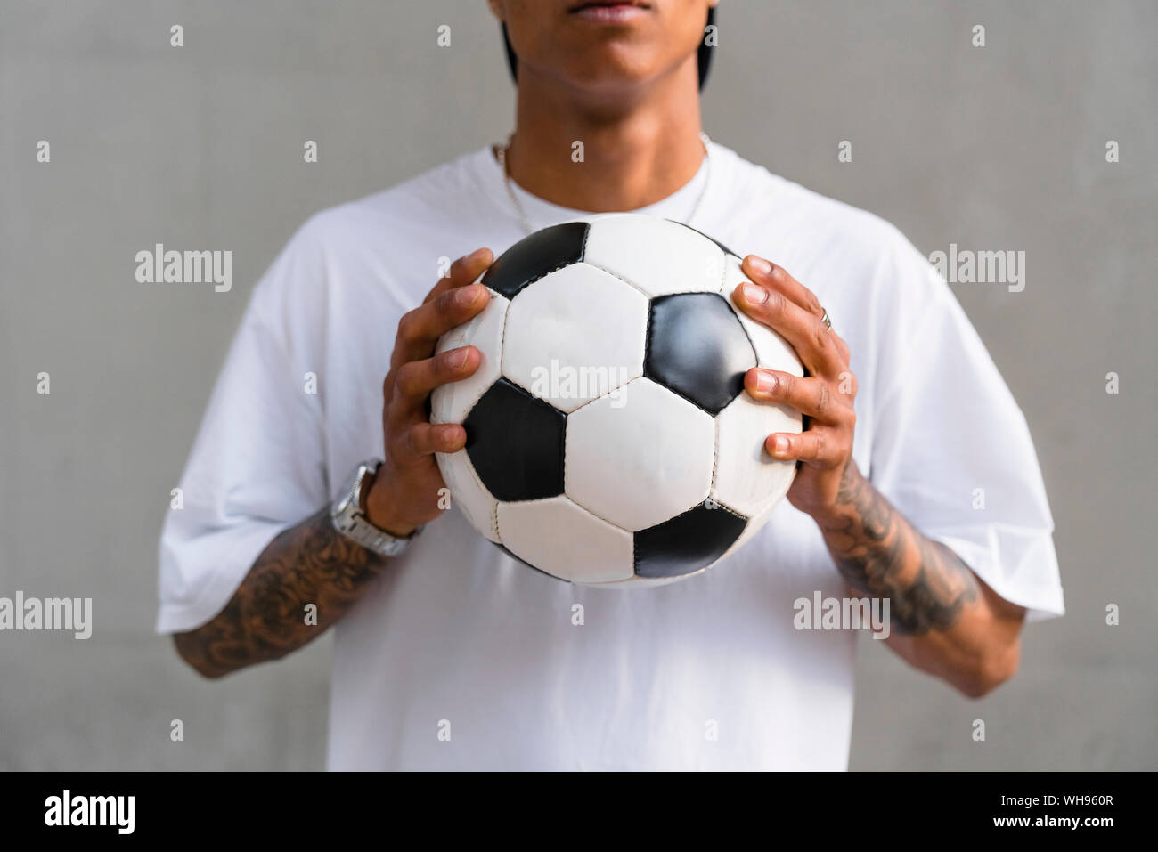 Holding football shirt hi-res stock photography and images - Alamy