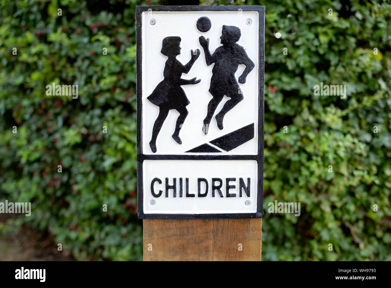 An unusual sign indicating children playing nearby Stock Photo - Alamy