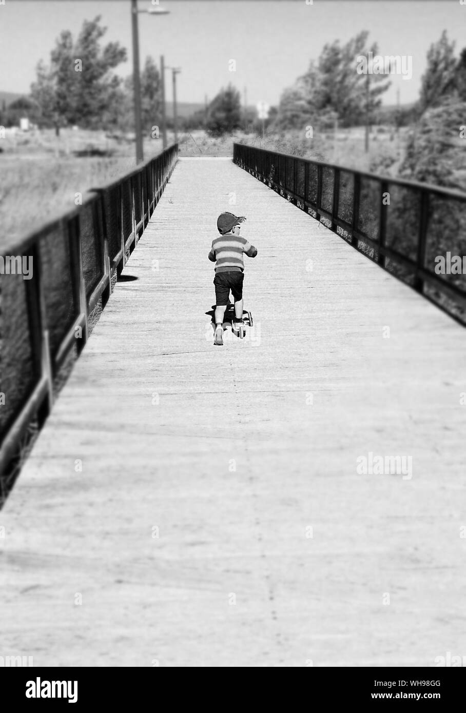 Boy on bridge hi-res stock photography and images - Alamy