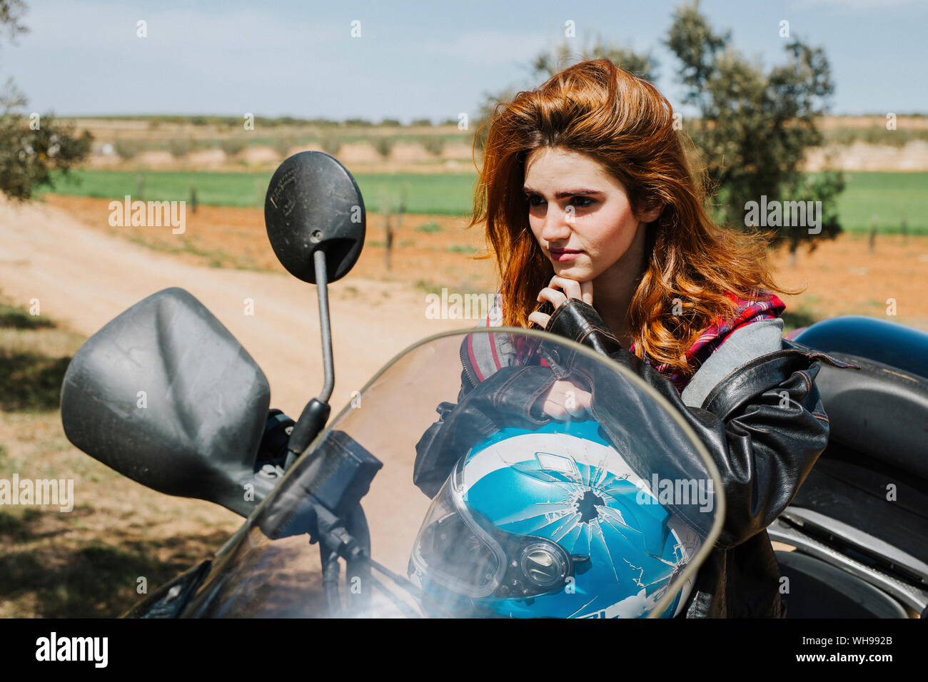 Portrait of redheaded woman on motorbike hi-res stock photography and ...