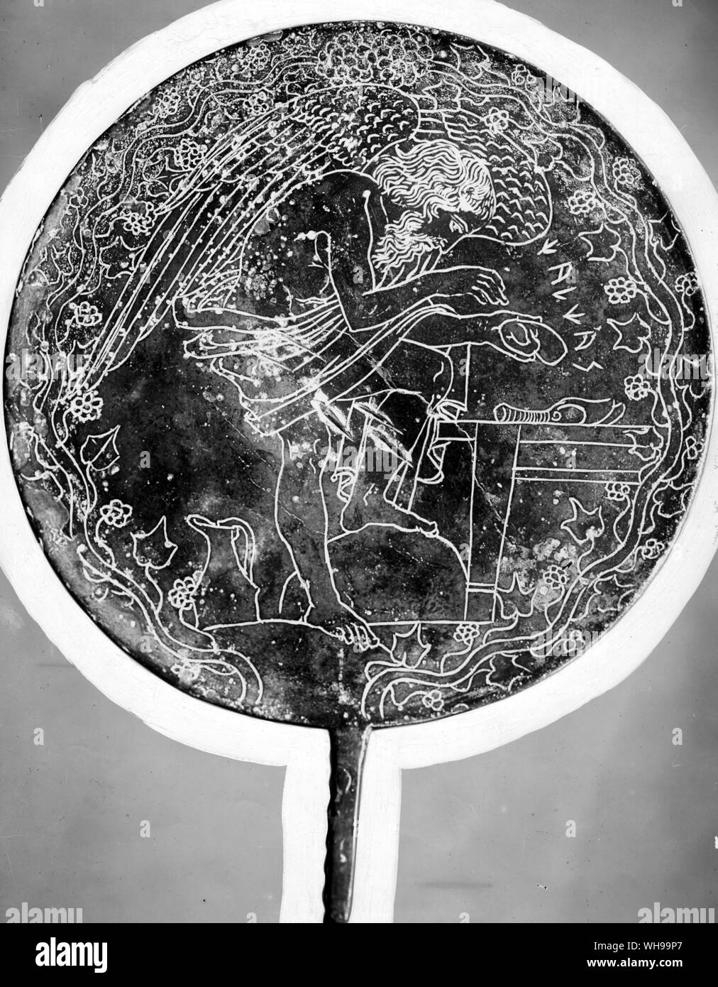An engraving on an Etruscan mirror with the figure of a haruspex in the ...