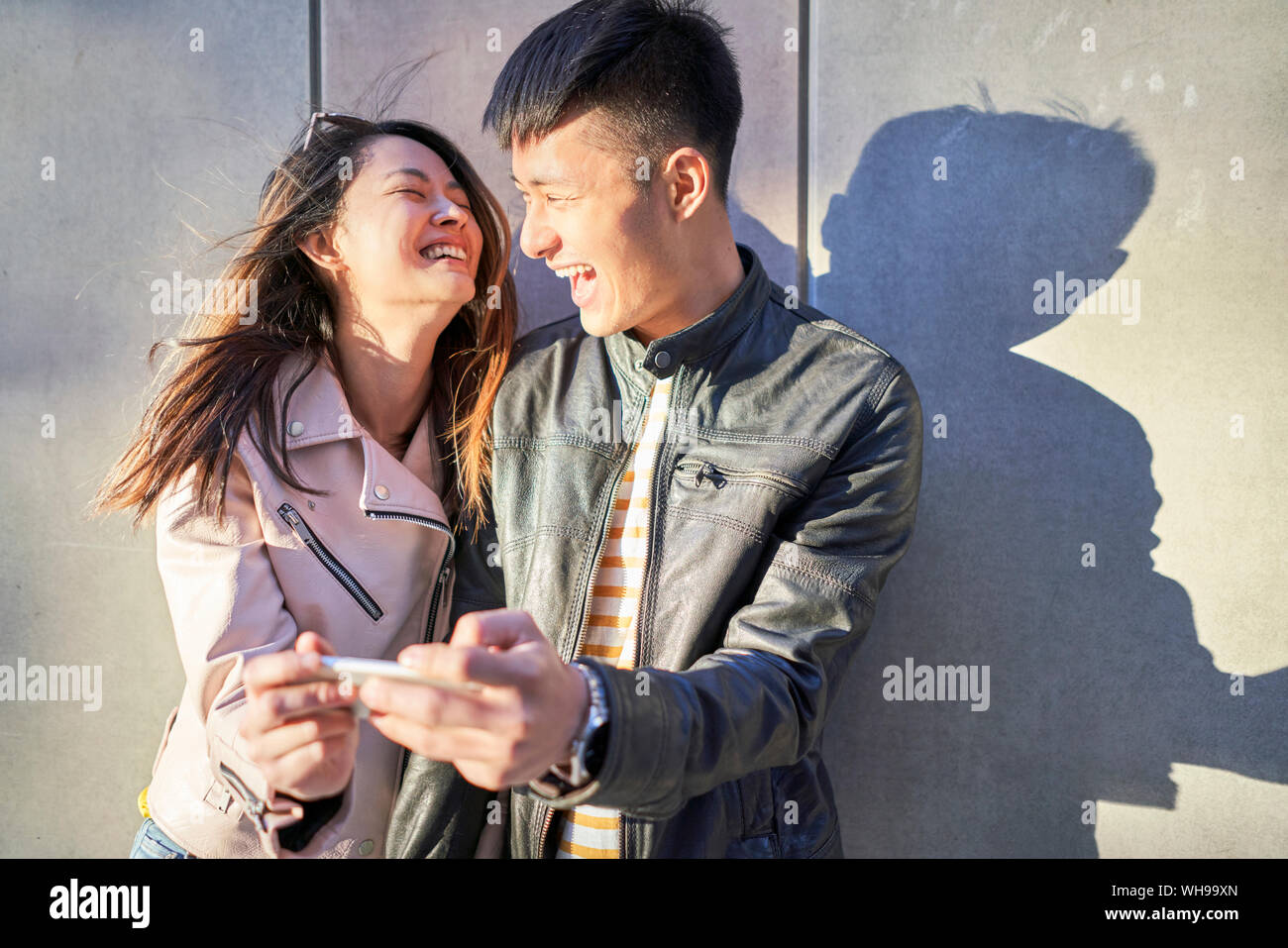 Asian couple laughing hi-res stock photography and images - Alamy