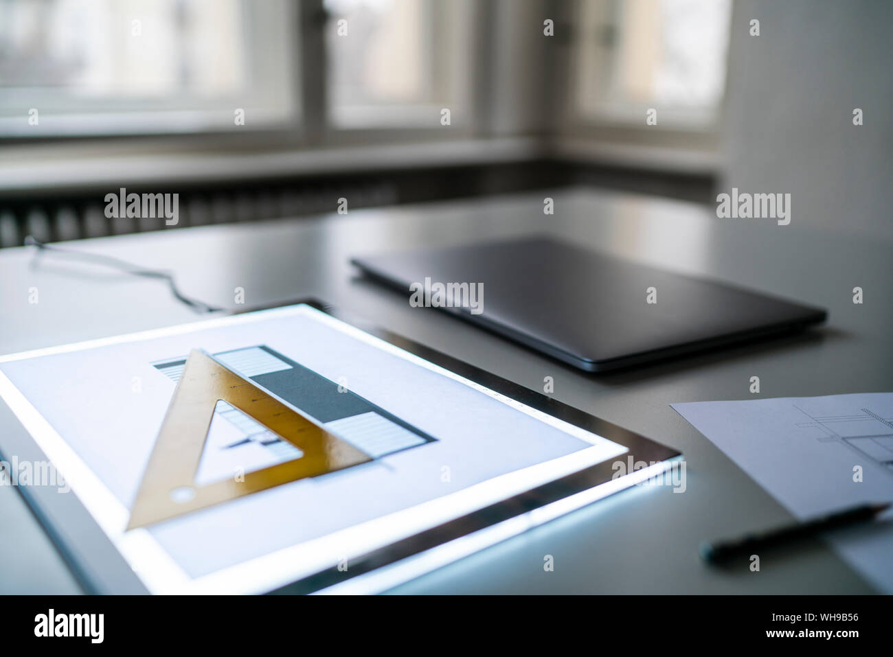 Architectural plan on tablet screen on desk Stock Photo - Alamy