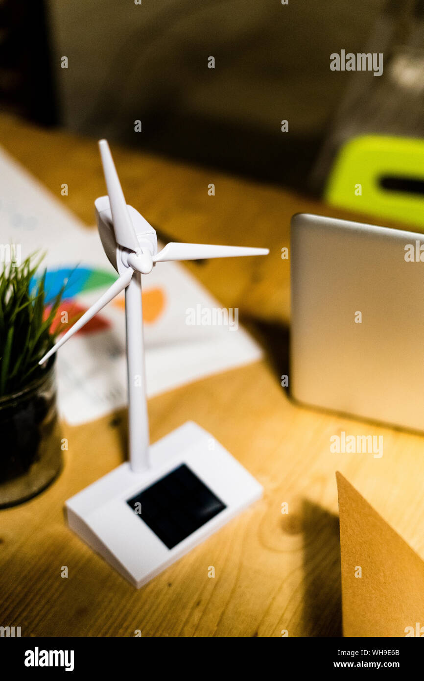 Laptop and wind turbine model on table hi-res stock photography and ...
