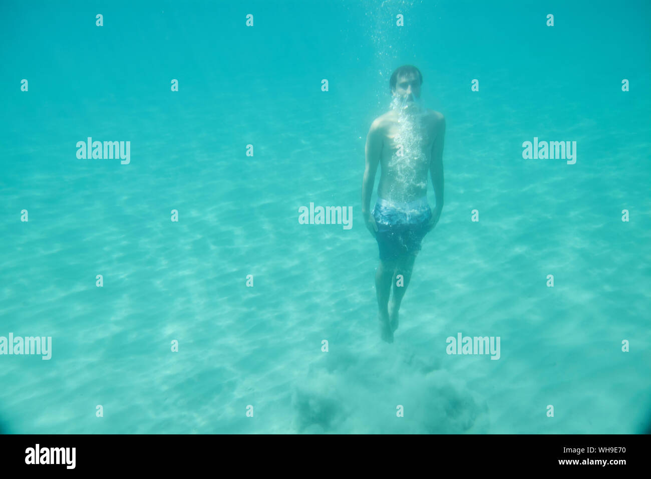 Underwater shot of man in the sea Stock Photo - Alamy