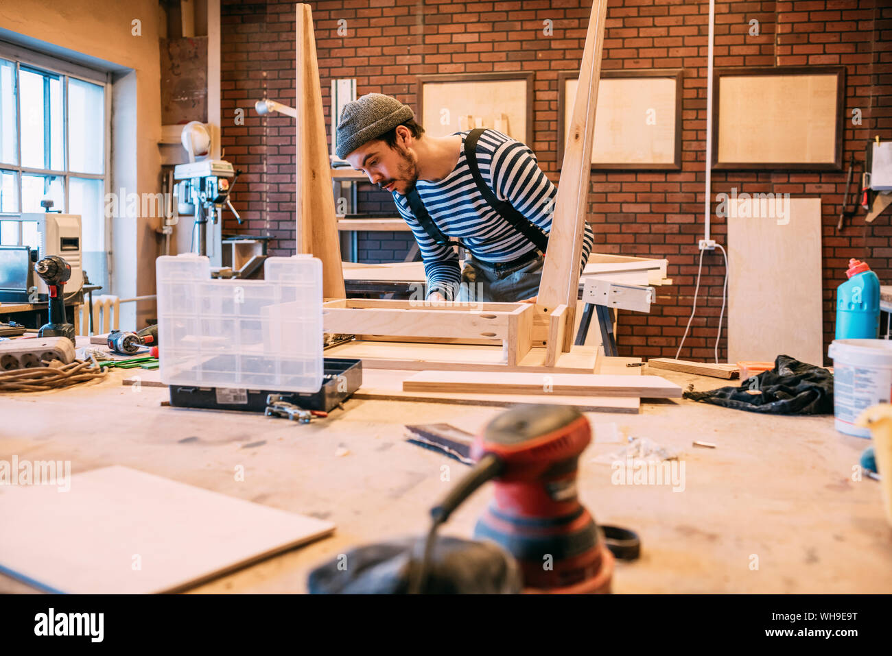 Carpenter working on wooden furniture hi-res stock photography and ...