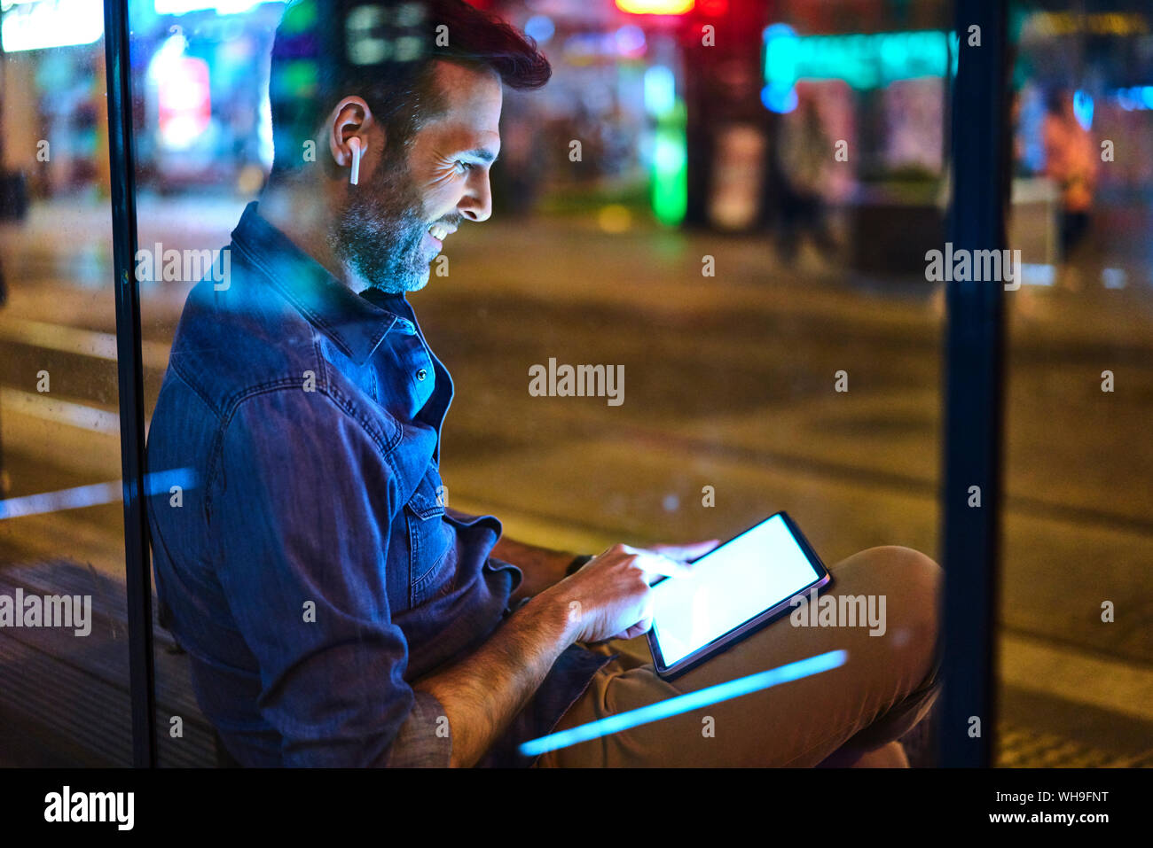 Man headphones public transport hi-res stock photography and images - Alamy