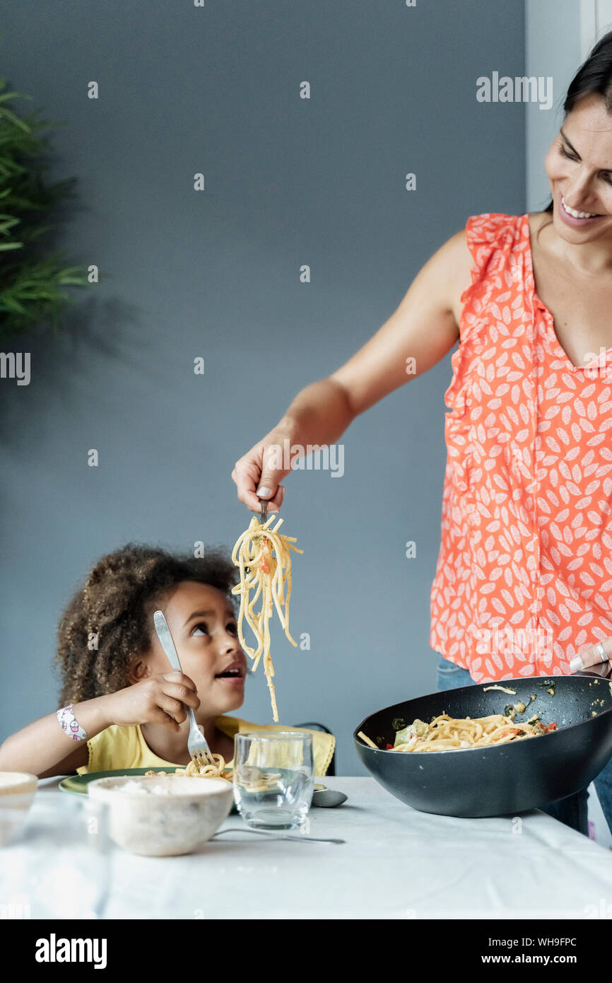 Mother serving pasta child hi-res stock photography and images - Alamy