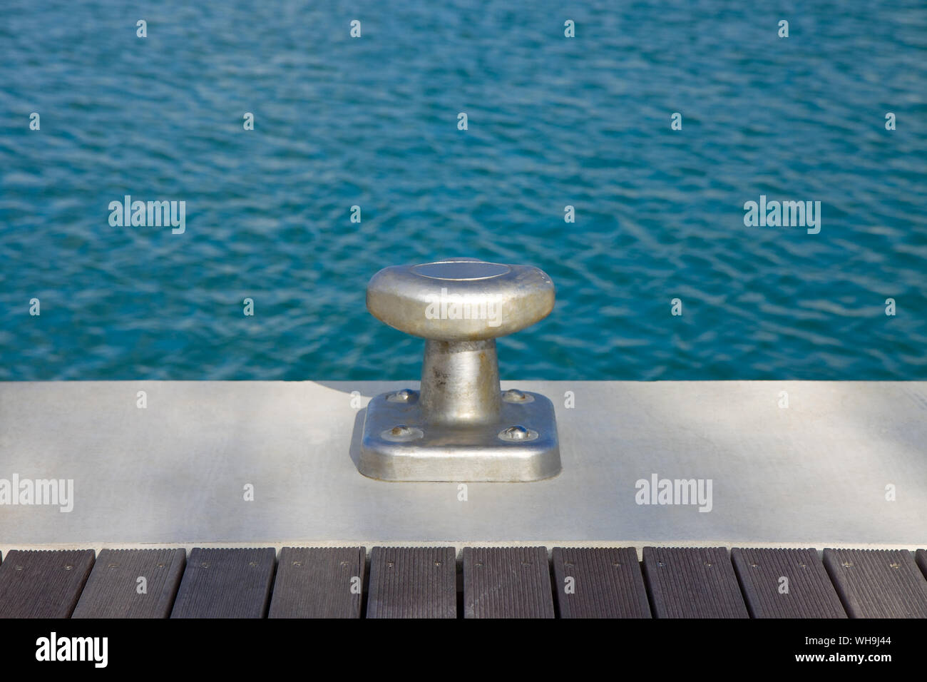 Cleat for mooring boats. Space for text insertion Stock Photo - Alamy