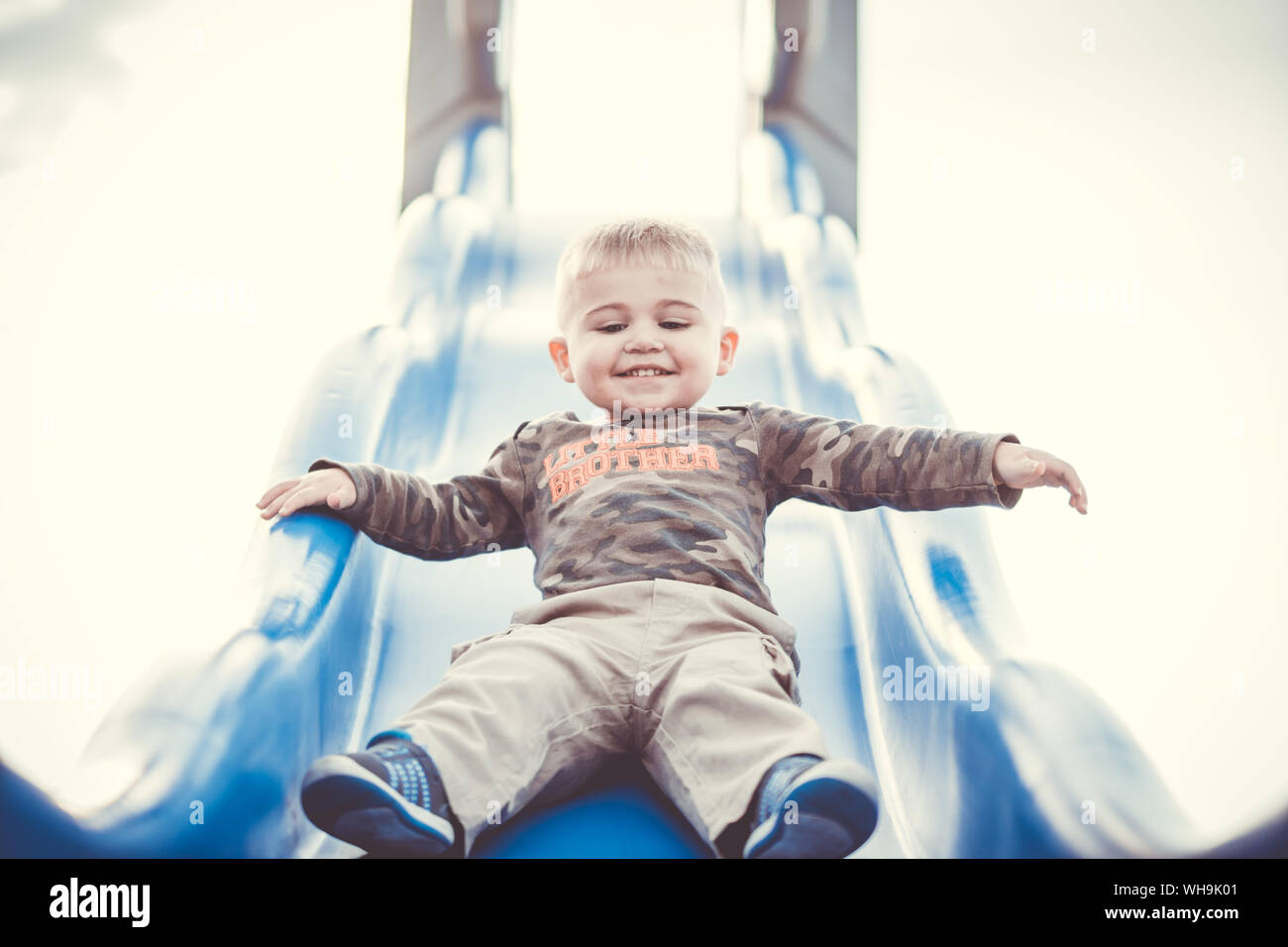 Sliding boys hi-res stock photography and images - Alamy