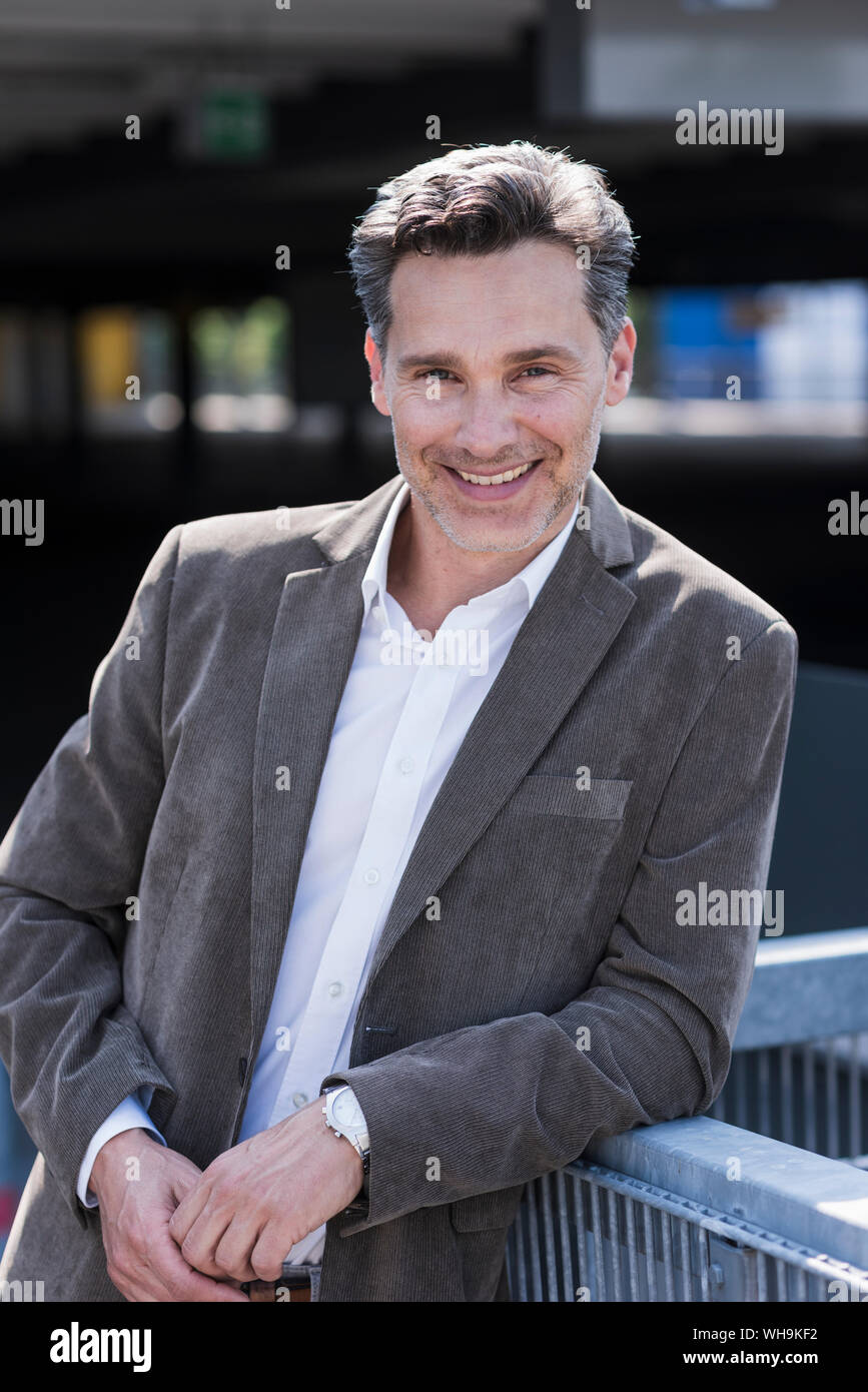 Wearing grey suit hi-res stock photography and images - Alamy