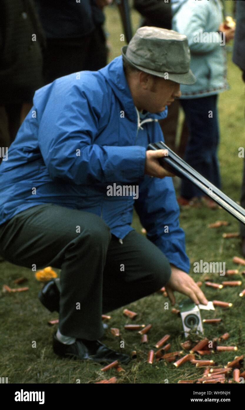 Clay pigeon shooting at Game Fair reloading gun Stock Photo - Alamy