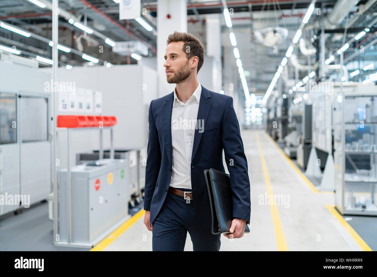 Man walking in a plant hi-res stock photography and images - Alamy