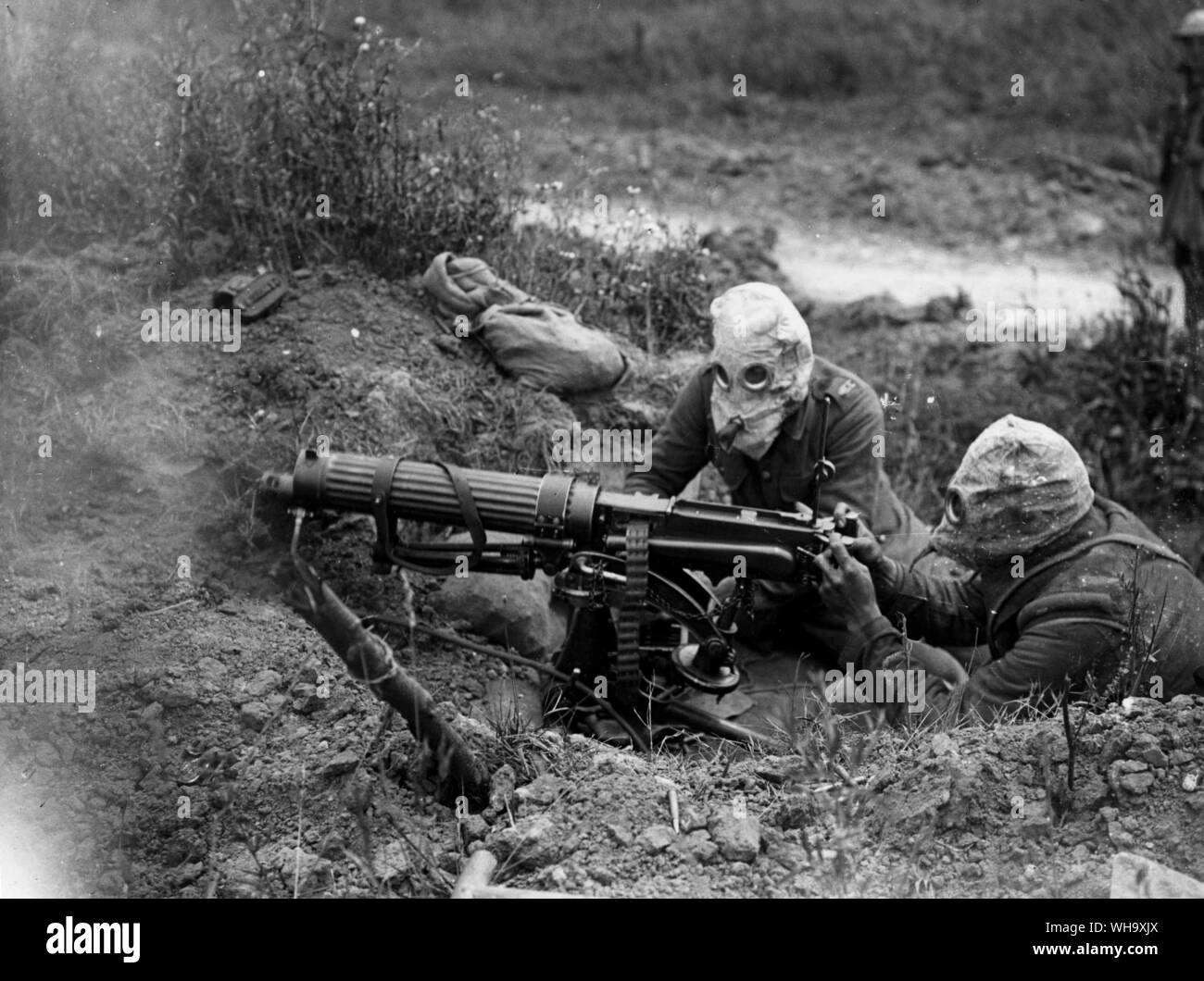 WW1: Battle of the Somme. Machine gunners wearing their gas masks, near ...
