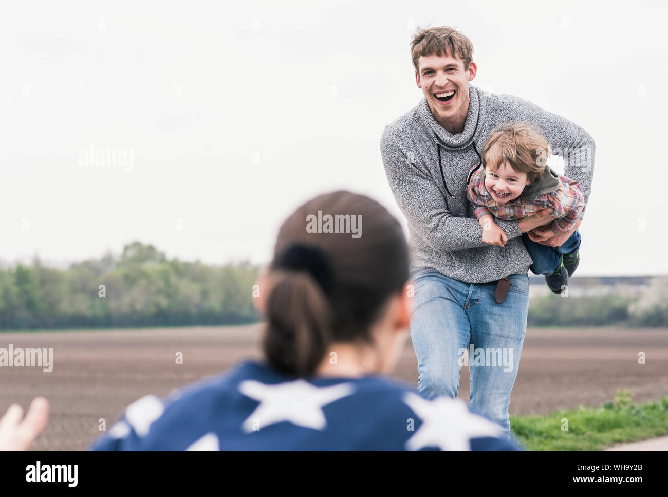 Happy family having fun, outdoors Stock Photo - Alamy