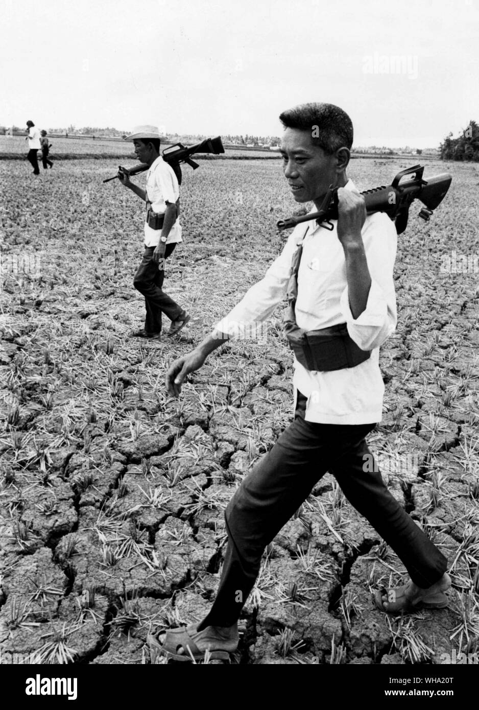 Vietnam war: Vietnamese carry rifles Stock Photo - Alamy