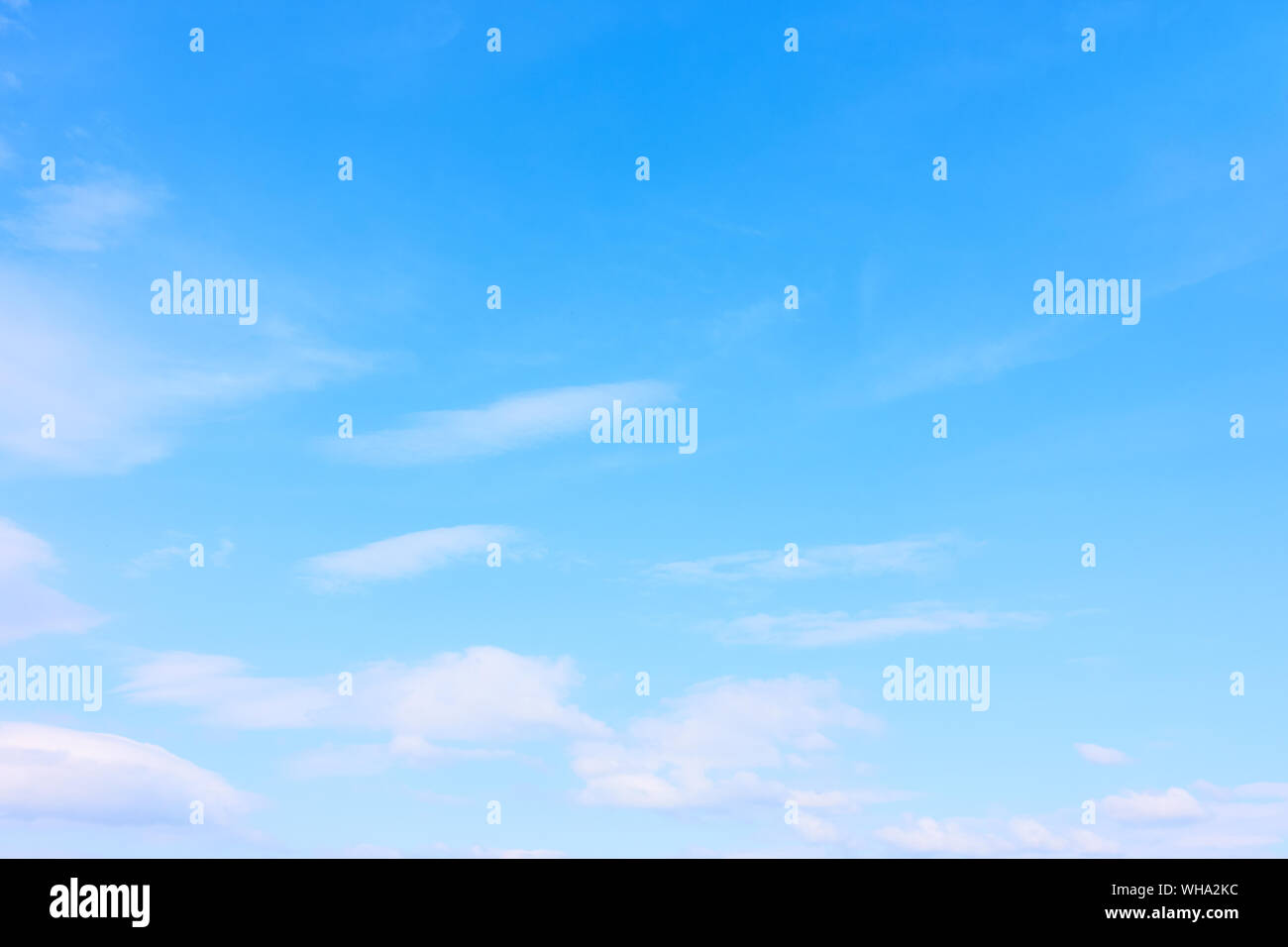 Light blue sky with clouds - may be used as background Stock Photo - Alamy